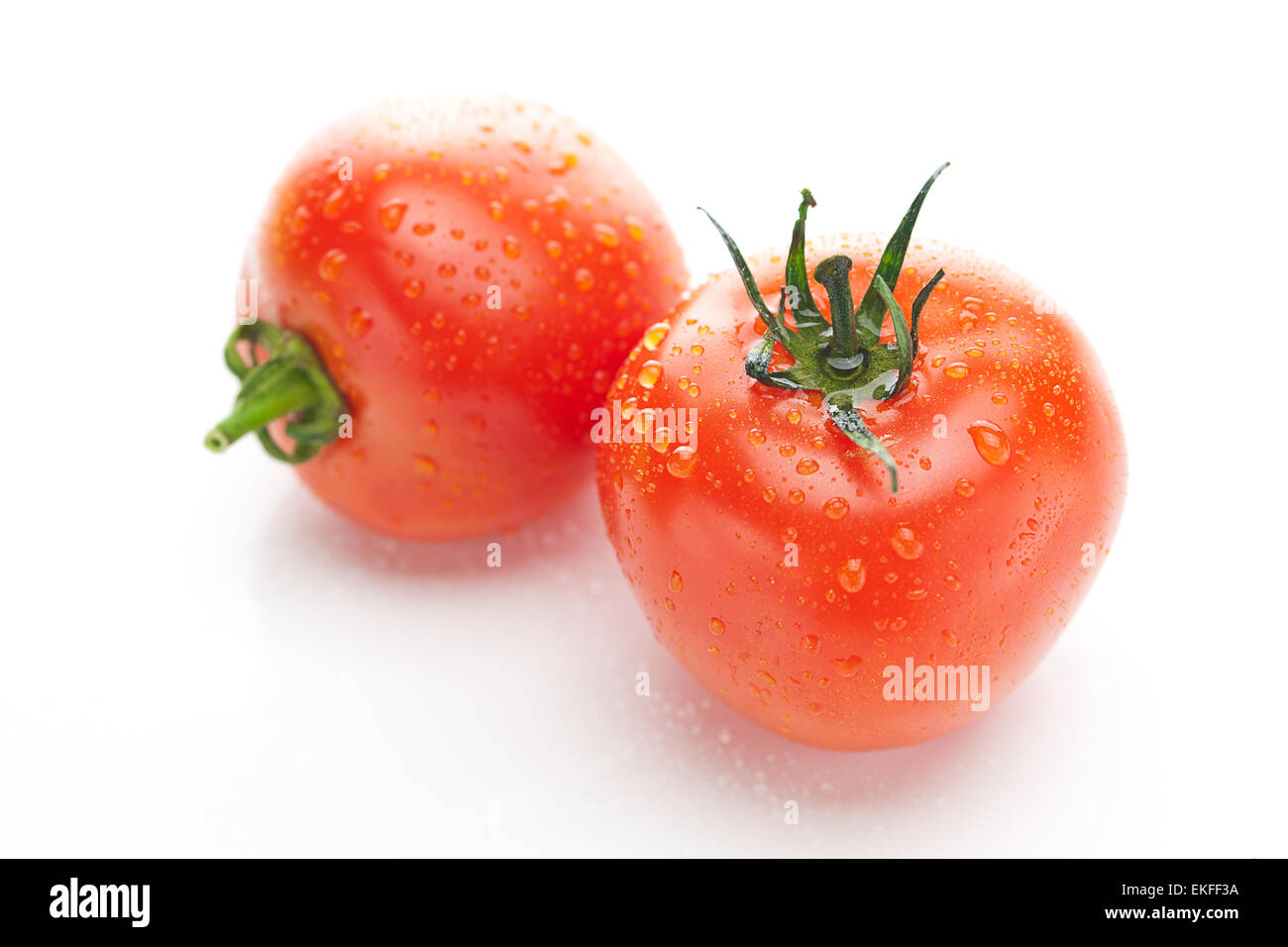 red ripe tomato isolated on white Stock Photo - Alamy