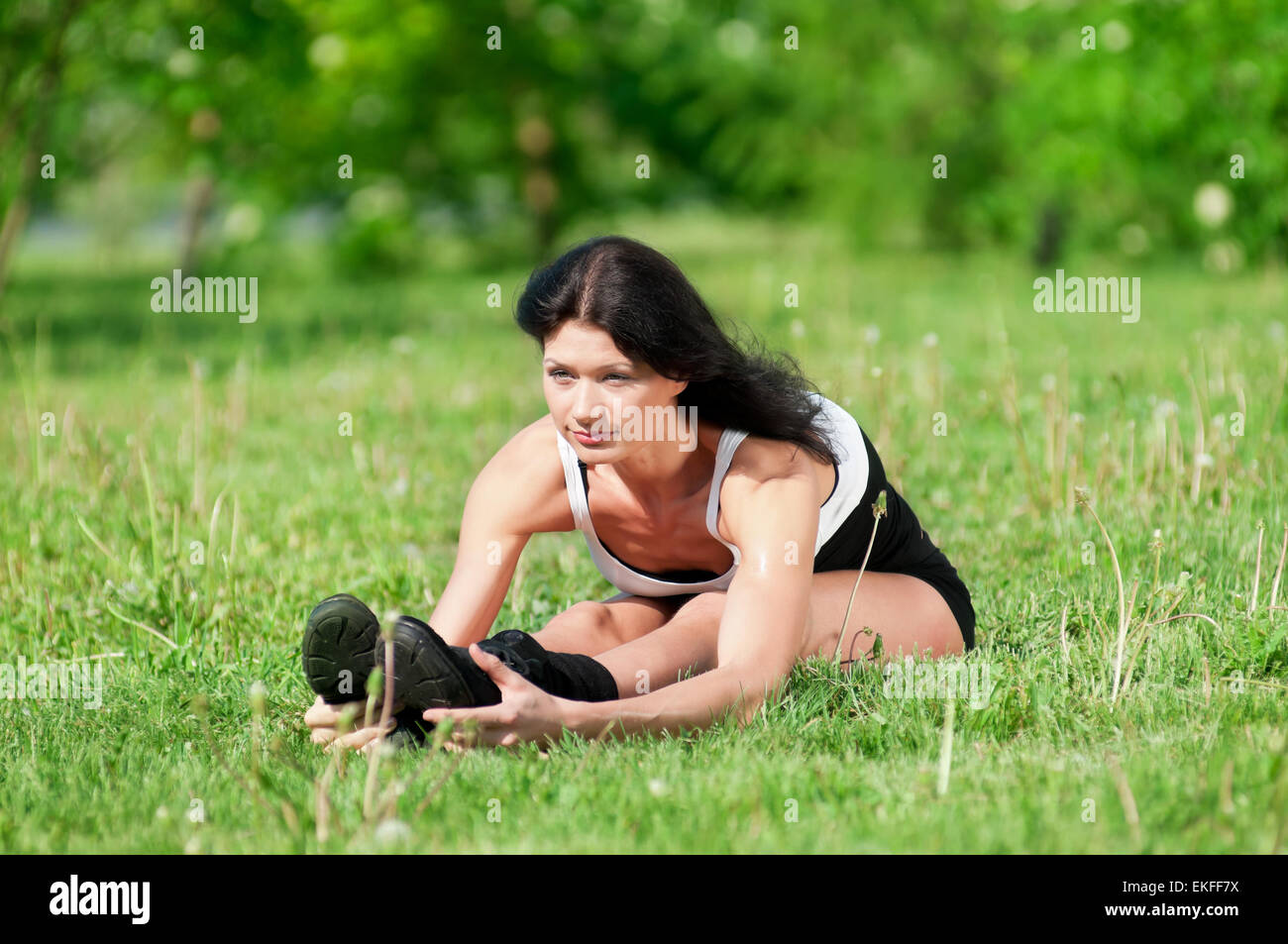 Woman doing stretching exercise. Yoga Stock Photo - Alamy