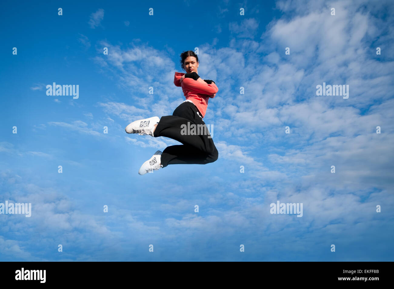 sport woman jumping and fly over sky Stock Photo - Alamy