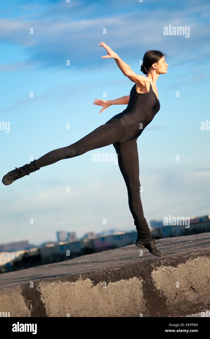 dancing woman over blue sky. Yoga Stock Photo - Alamy