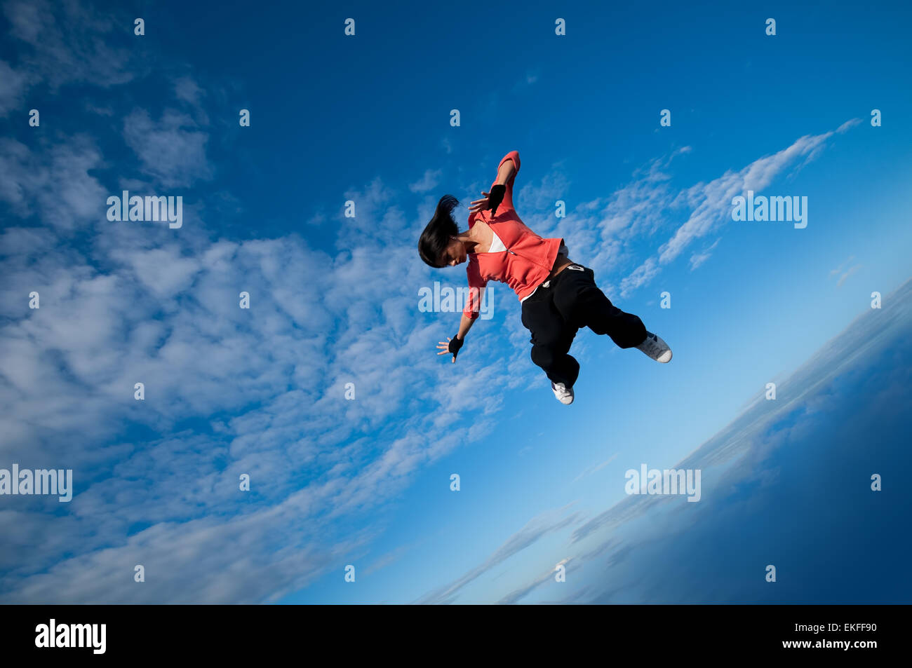 sport woman jumping and fly over sky Stock Photo - Alamy