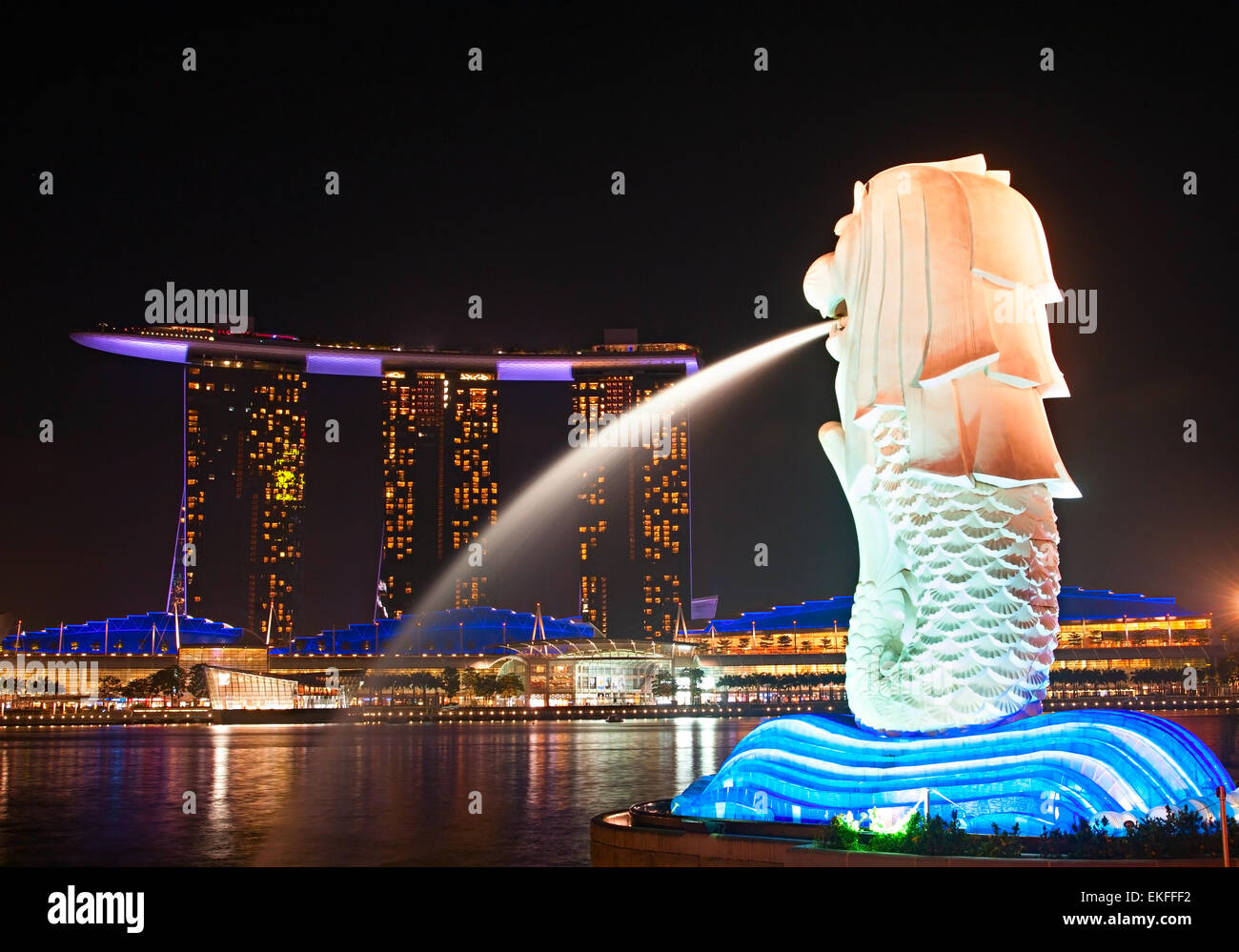 The Merlion fountain spouts water in front of the Marina Bay Sands ...