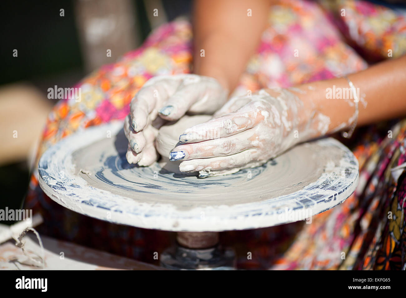 hand on a potter wheel at the fair Stock Photo - Alamy