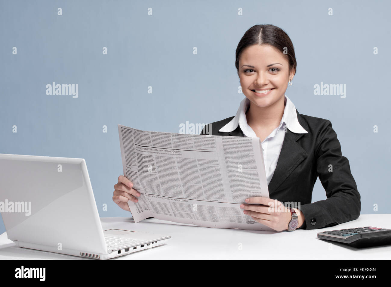 Business woman with newspaper Stock Photo - Alamy