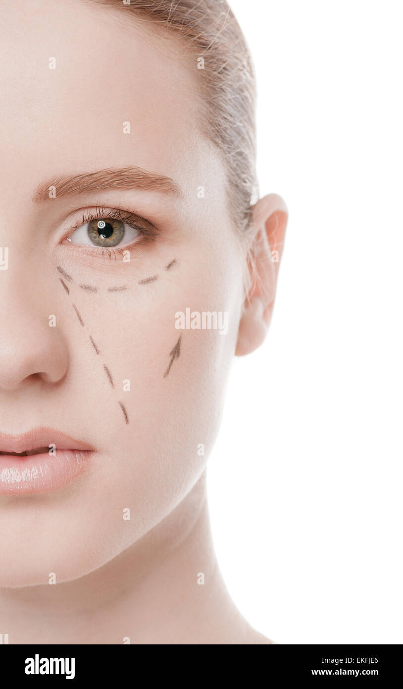Beautician draw correction lines on woman face Stock Photo - Alamy