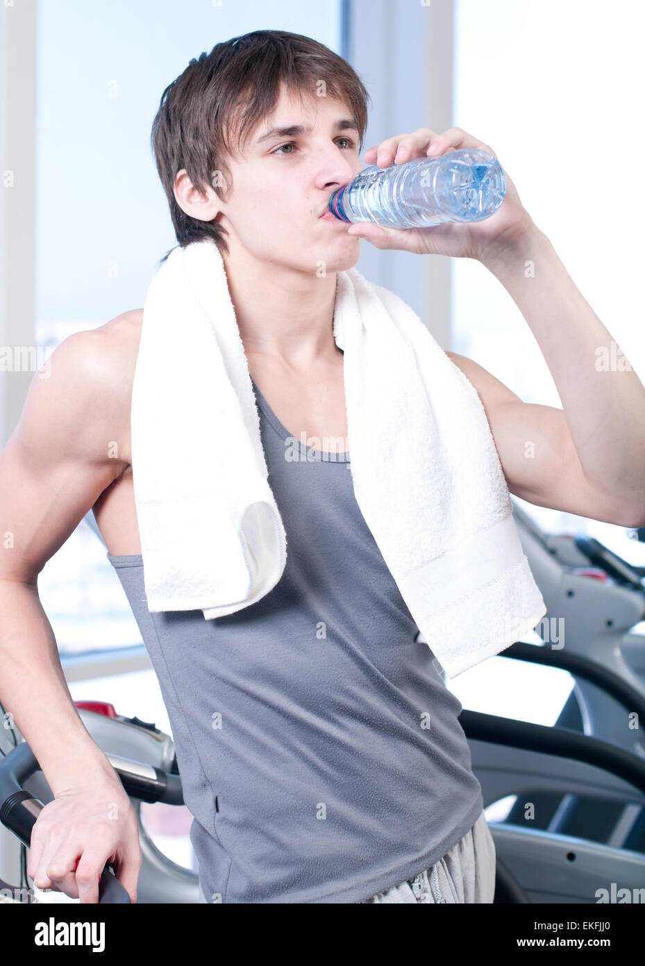 man at the gym drinking water Stock Photo - Alamy