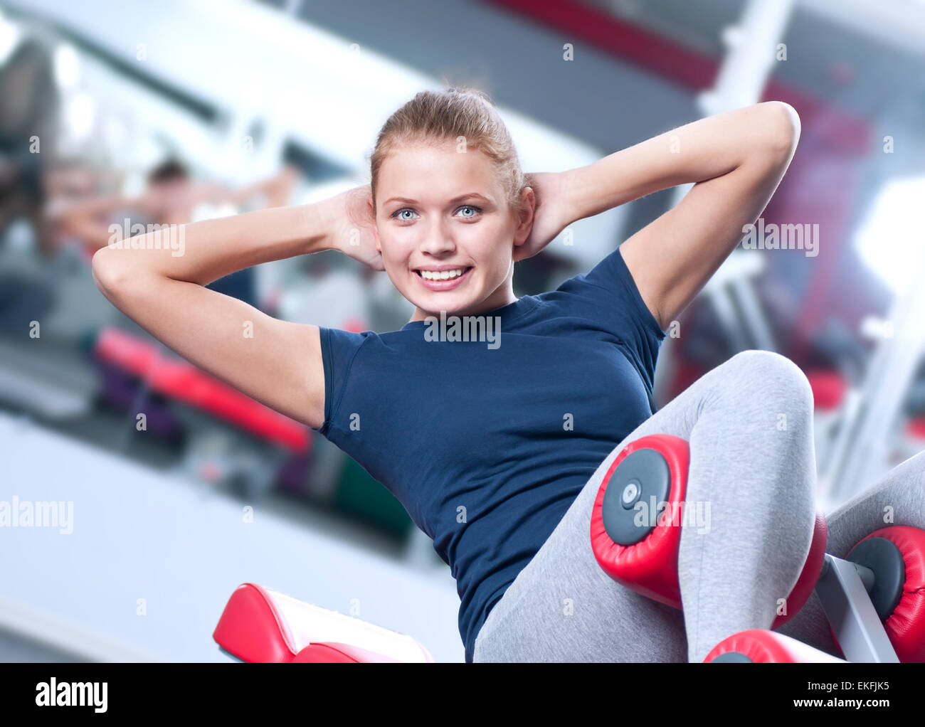 Woman at the gym exercising Stock Photo - Alamy