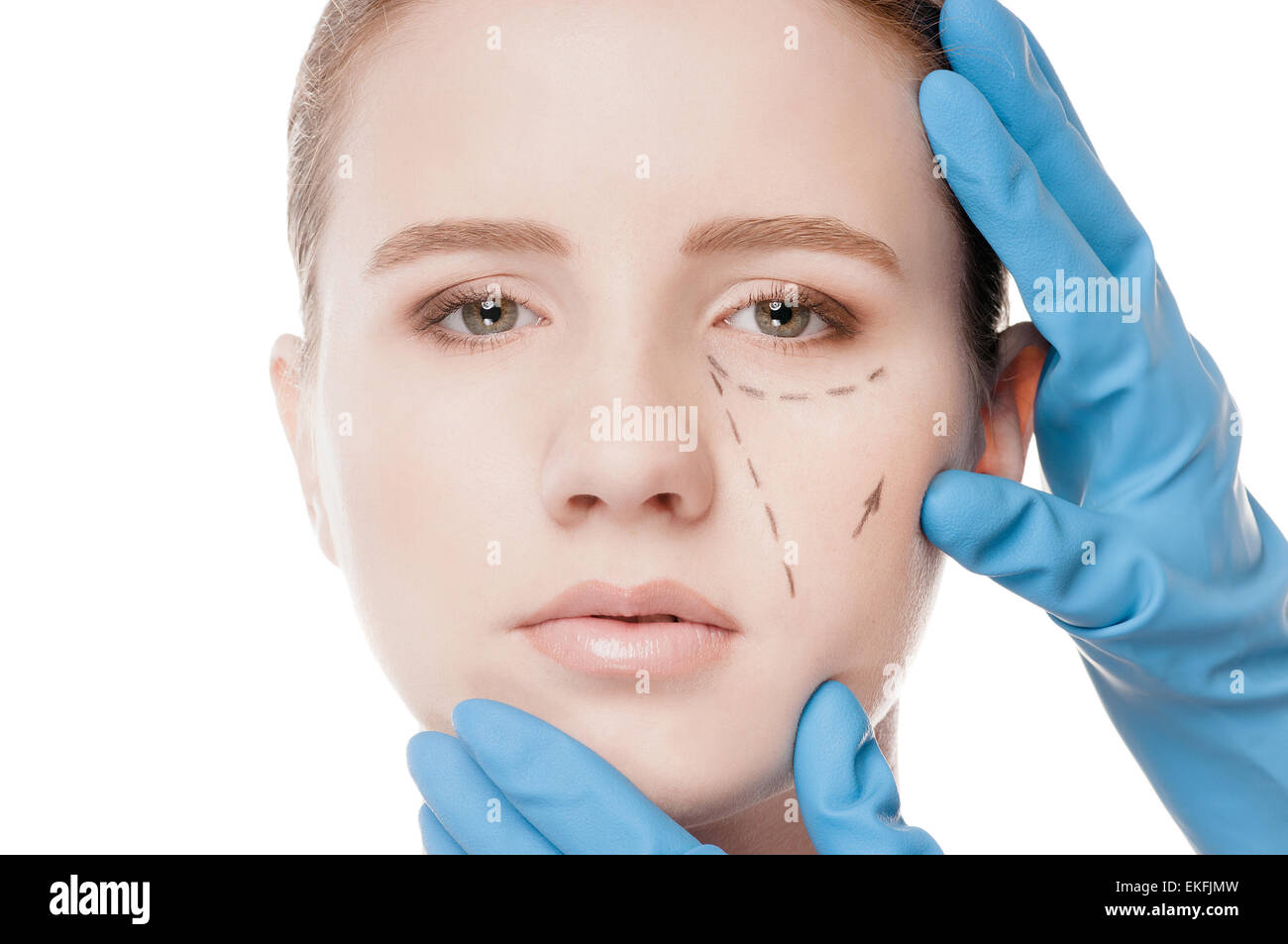 Beautician draw correction lines on woman face Stock Photo - Alamy