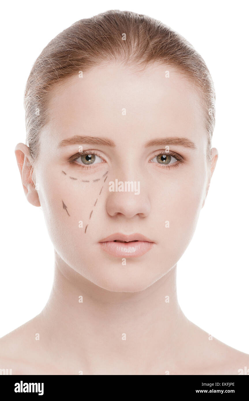 Beautician draw correction lines on woman face Stock Photo - Alamy