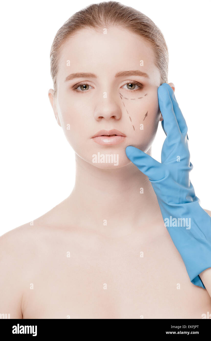 Beautician draw correction lines on woman face Stock Photo - Alamy