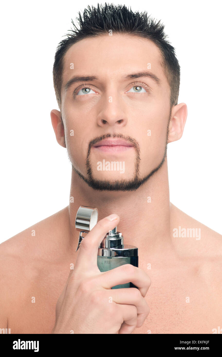 Young handsome man applying perfume Stock Photo - Alamy