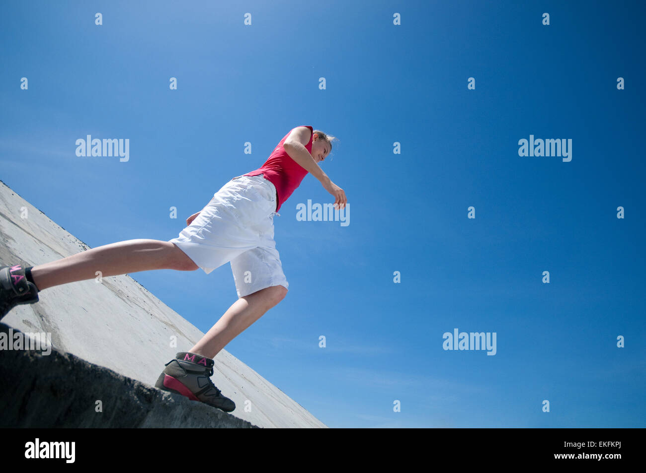 Beautiful woman jump into sky Stock Photo - Alamy
