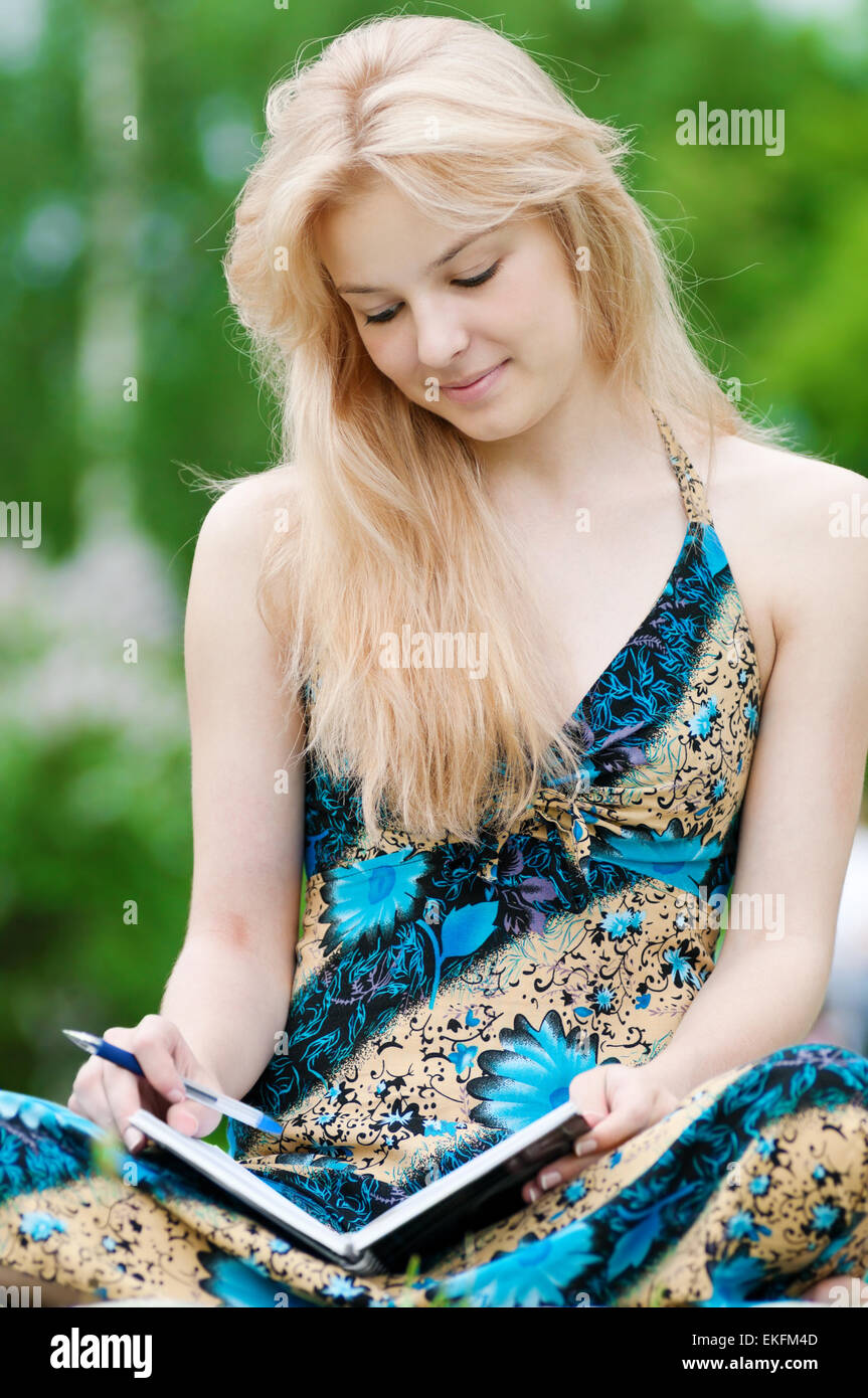 Beautiful young woman read book Stock Photo - Alamy