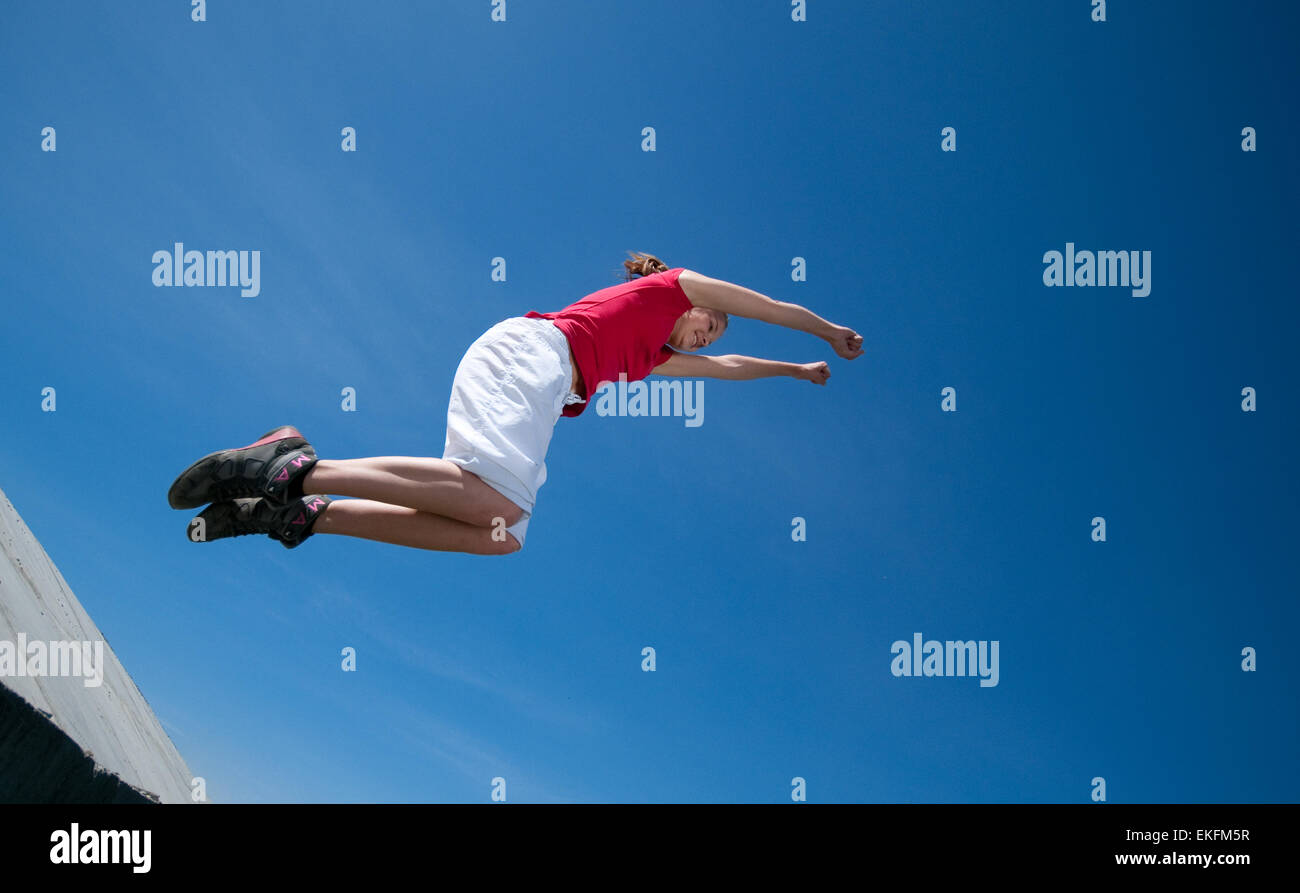 Beautiful woman jump into sky Stock Photo - Alamy