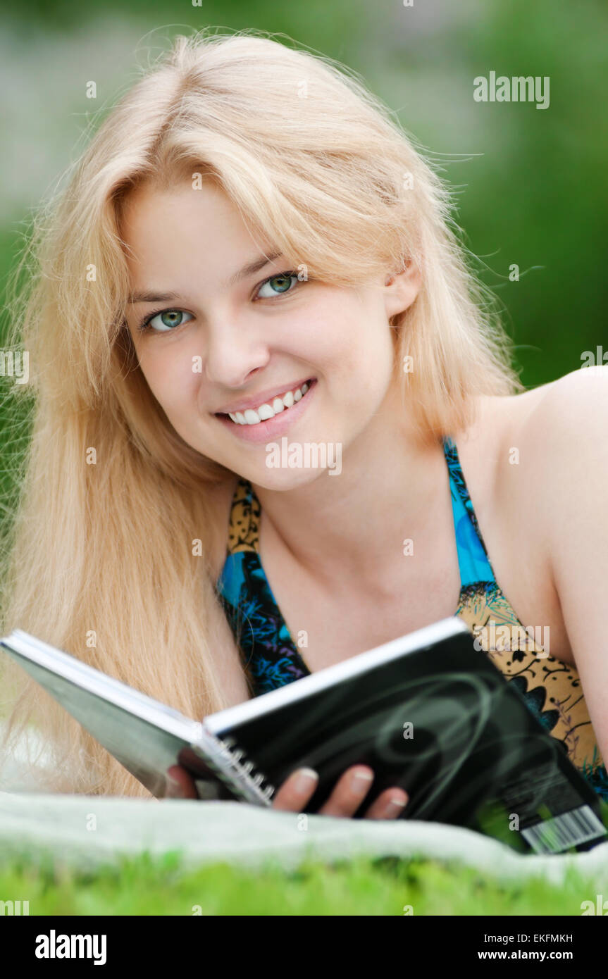 Beautiful young woman read book Stock Photo - Alamy