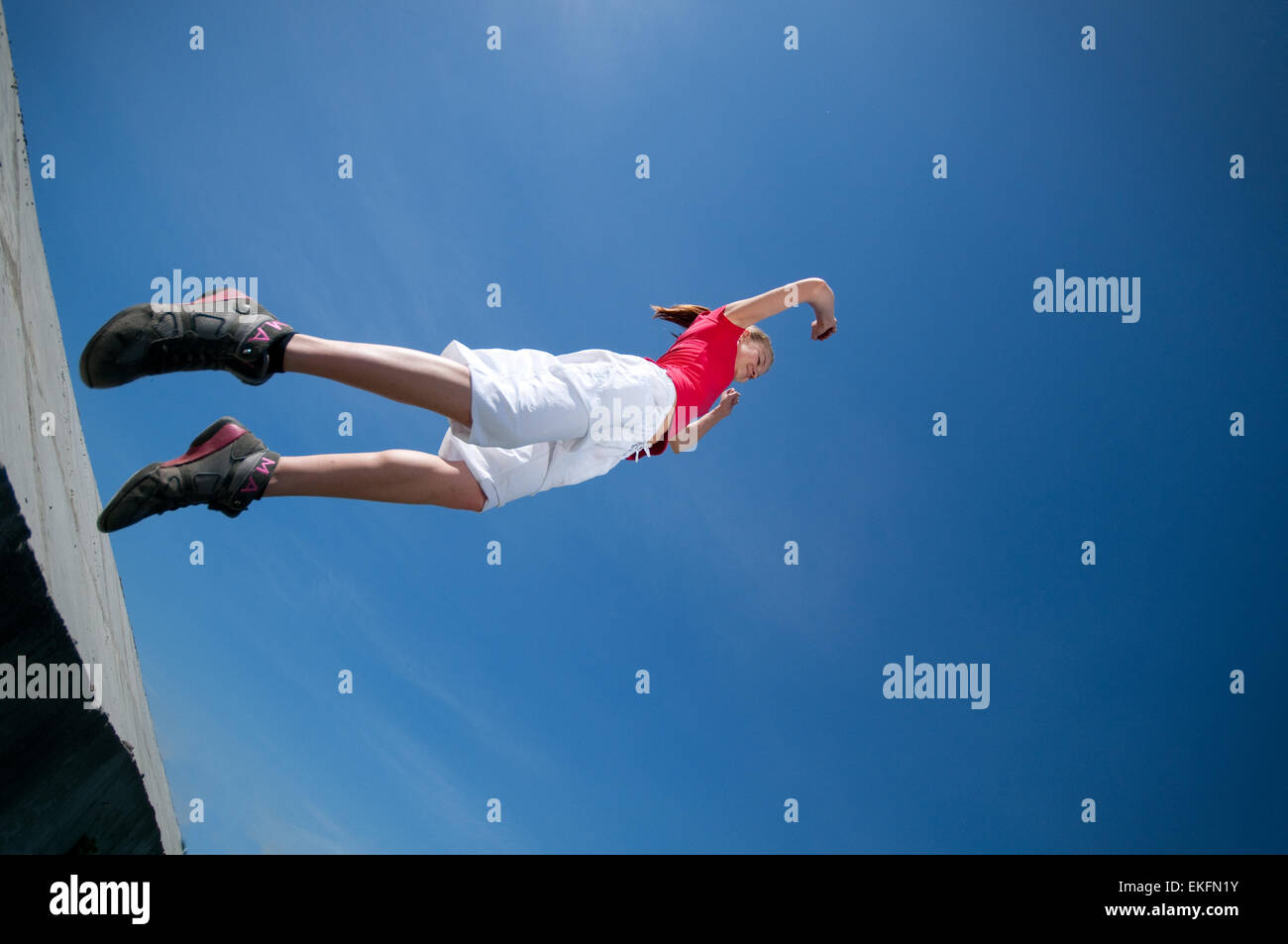 Beautiful woman jump into sky Stock Photo - Alamy