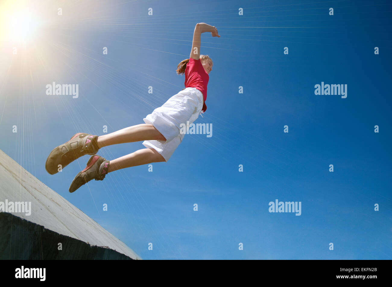 Beautiful woman jump into sky Stock Photo - Alamy