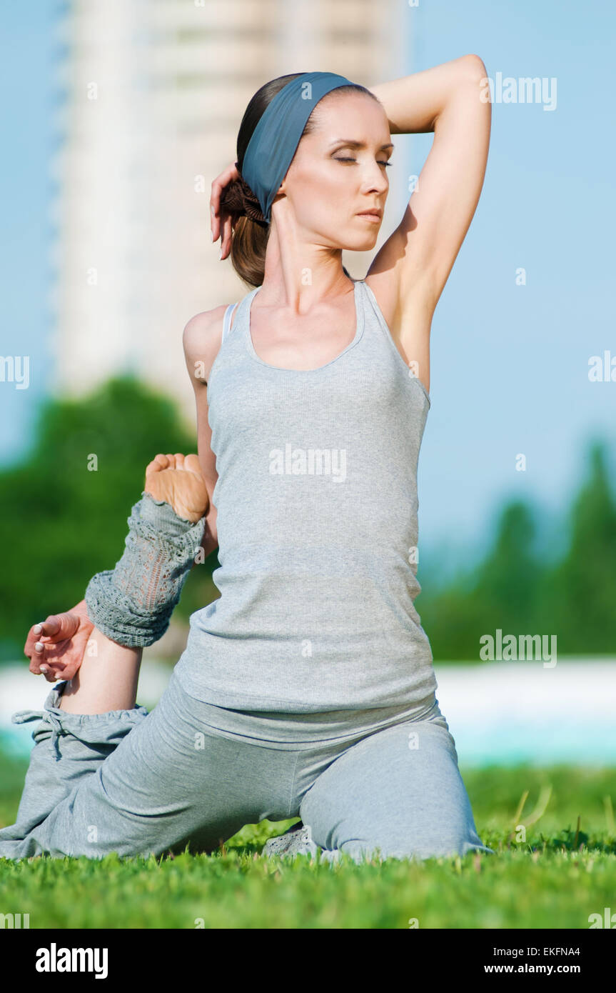 Beautiful woman doing stretching exercise Stock Photo - Alamy