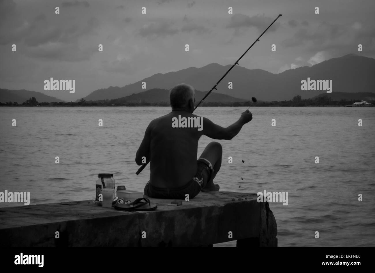 Fishing man on beach Black and White Stock Photos & Images - Alamy