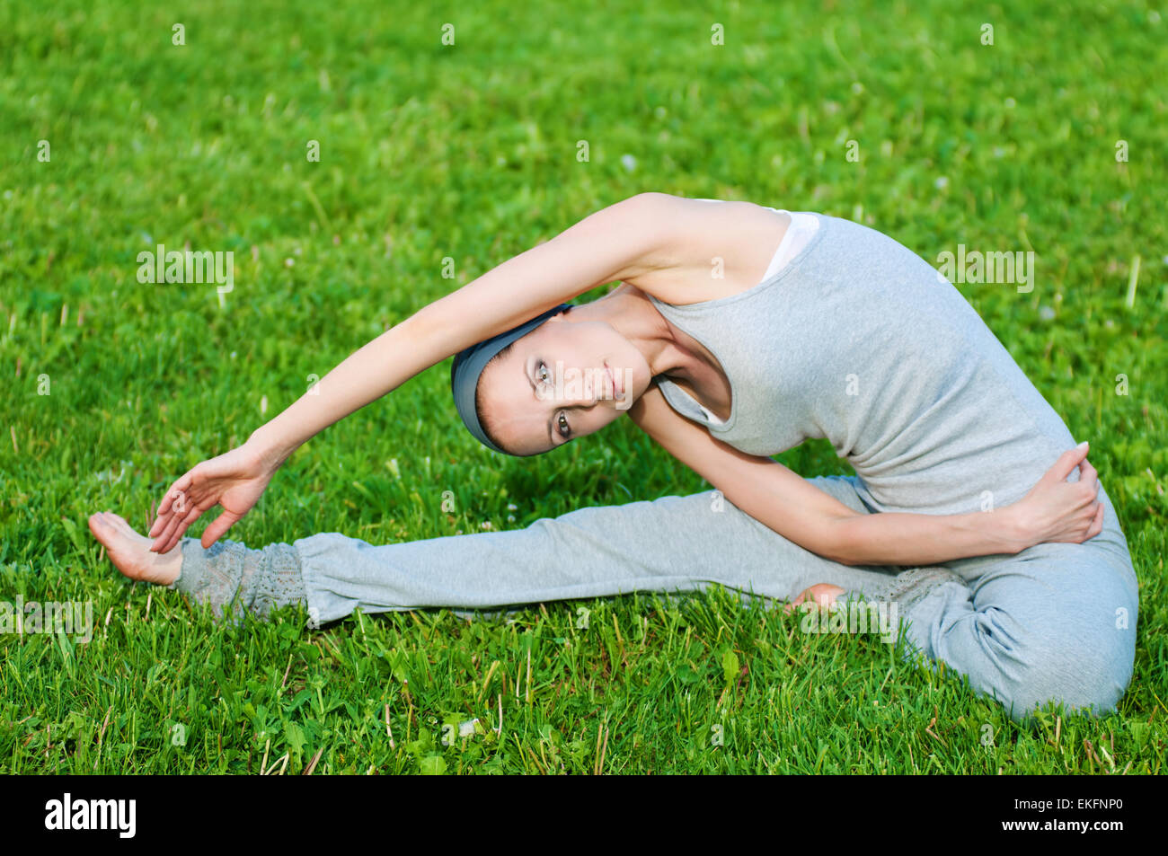 Beautiful woman doing stretching exercise Stock Photo - Alamy