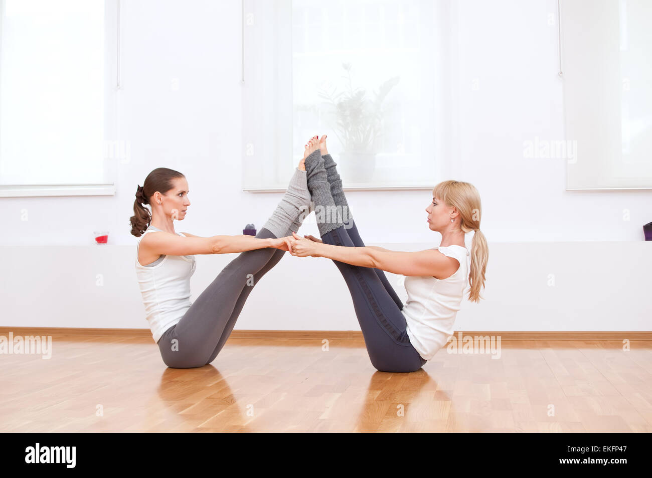 Women doing yoga exercise at gym Stock Photo - Alamy