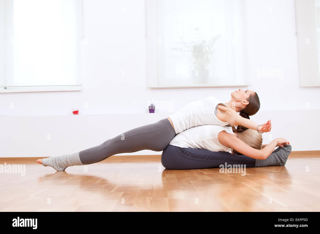 Women doing yoga exercise at gym Stock Photo - Alamy
