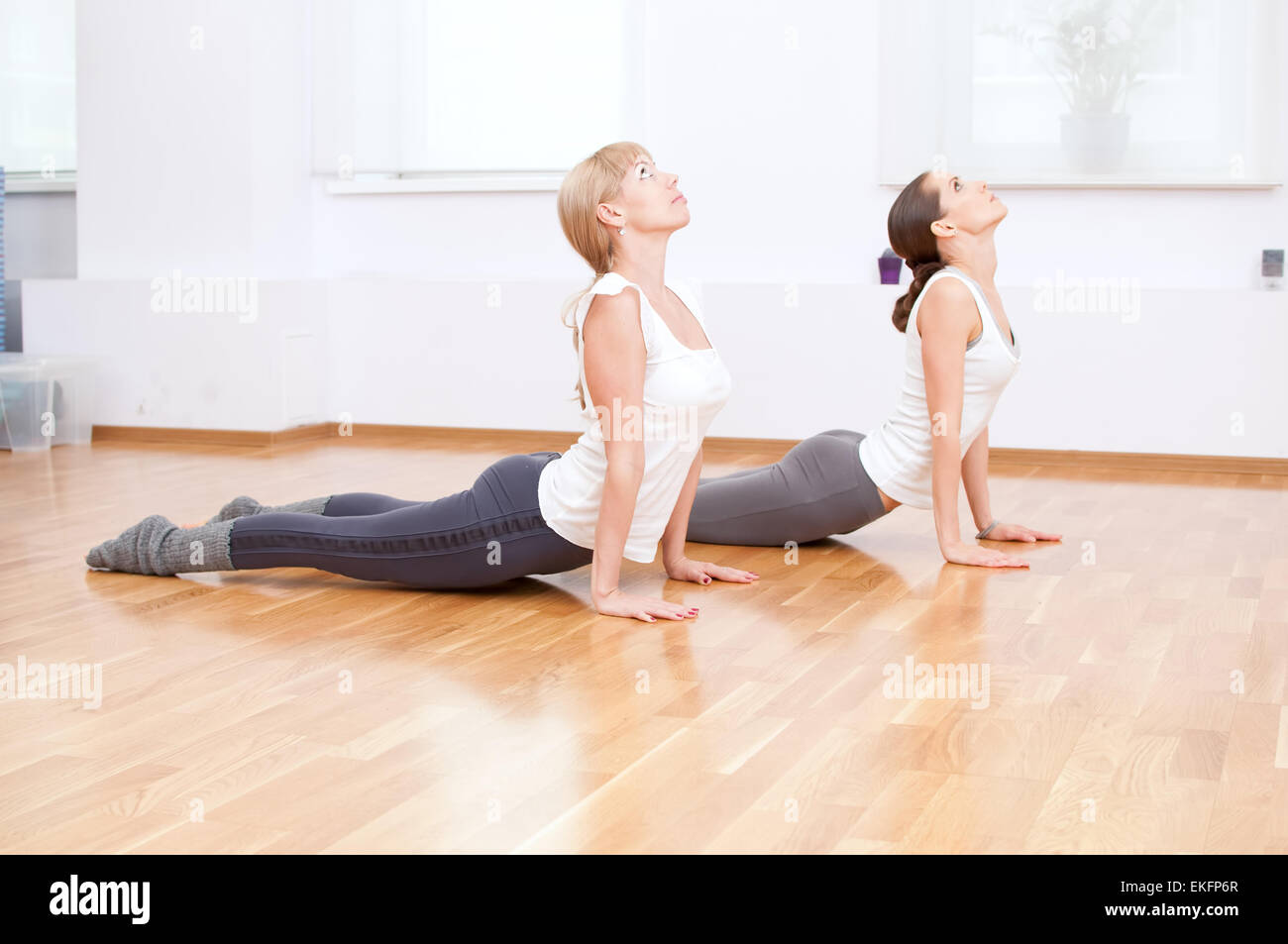 Women doing yoga exercise at gym Stock Photo - Alamy