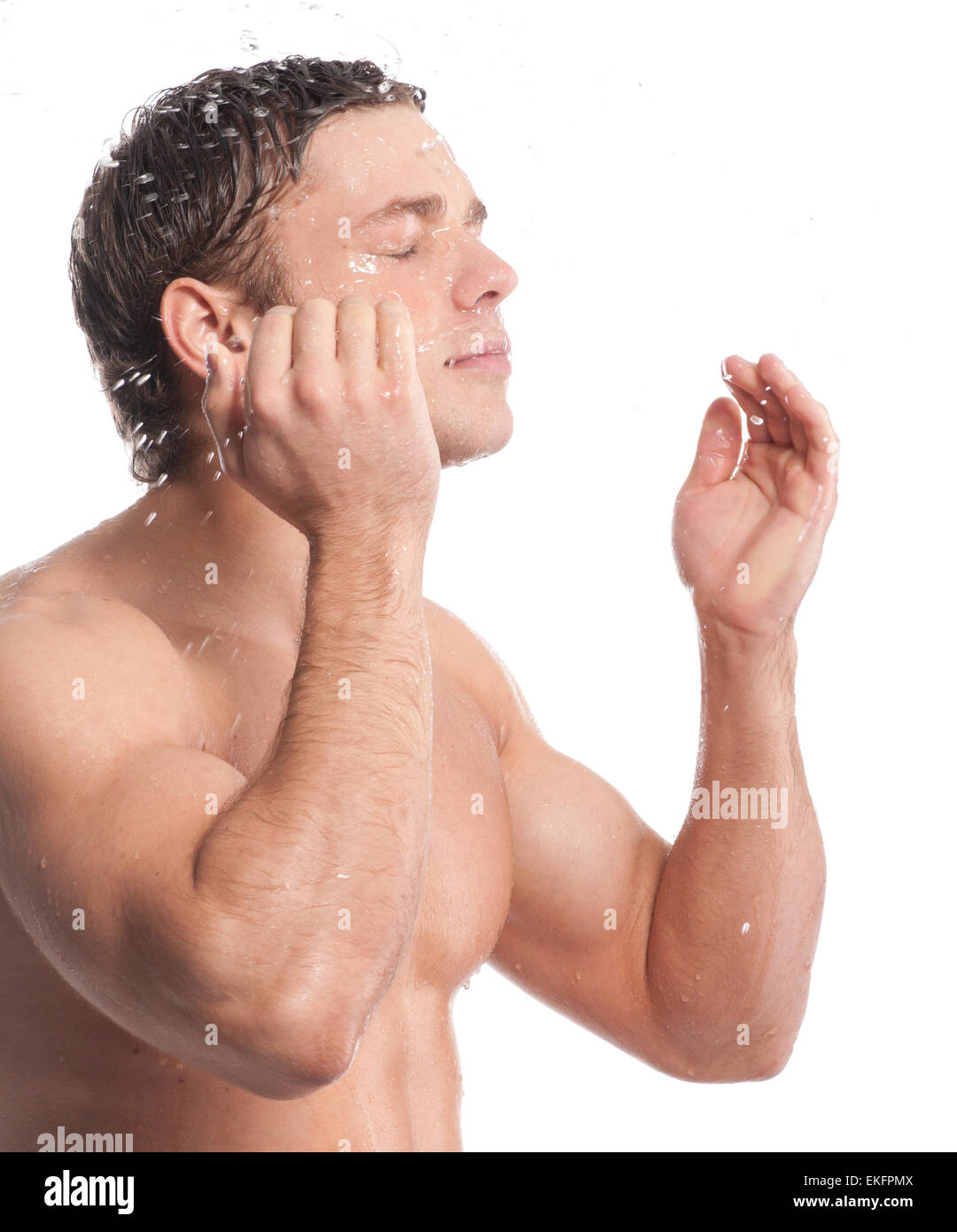 Young man wash face Stock Photo - Alamy