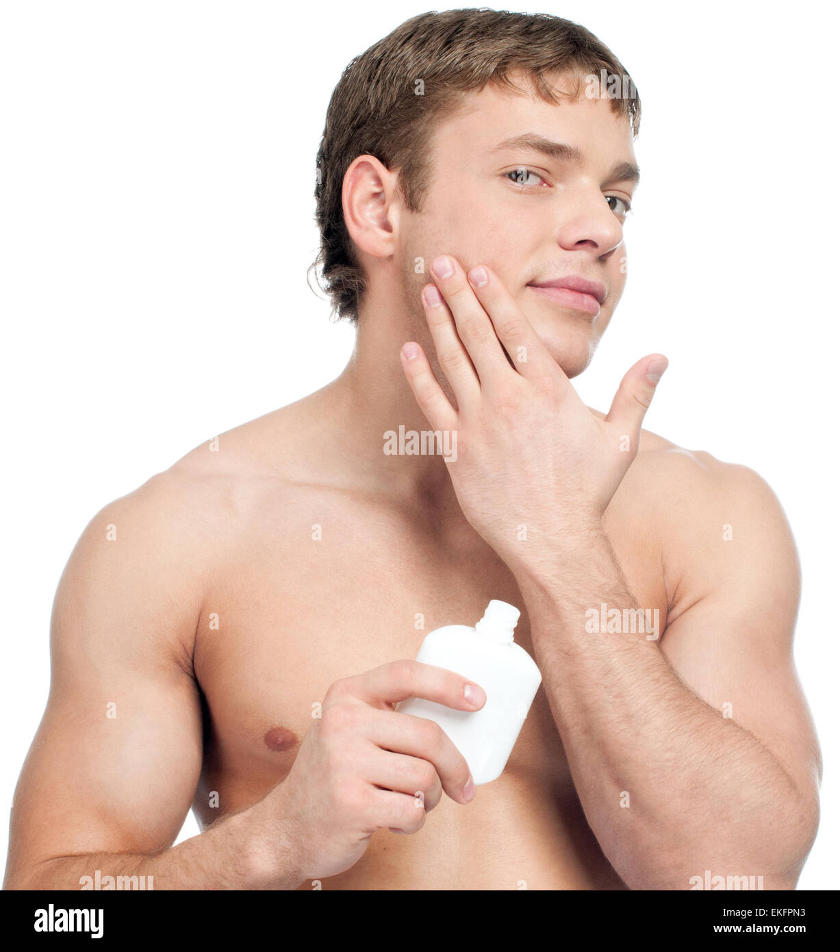 Man putting on cream lotion Stock Photo - Alamy