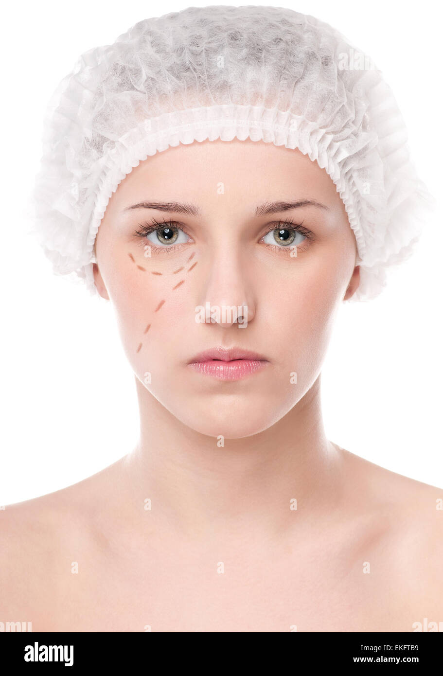 Beautician draw correction lines on woman face Stock Photo - Alamy