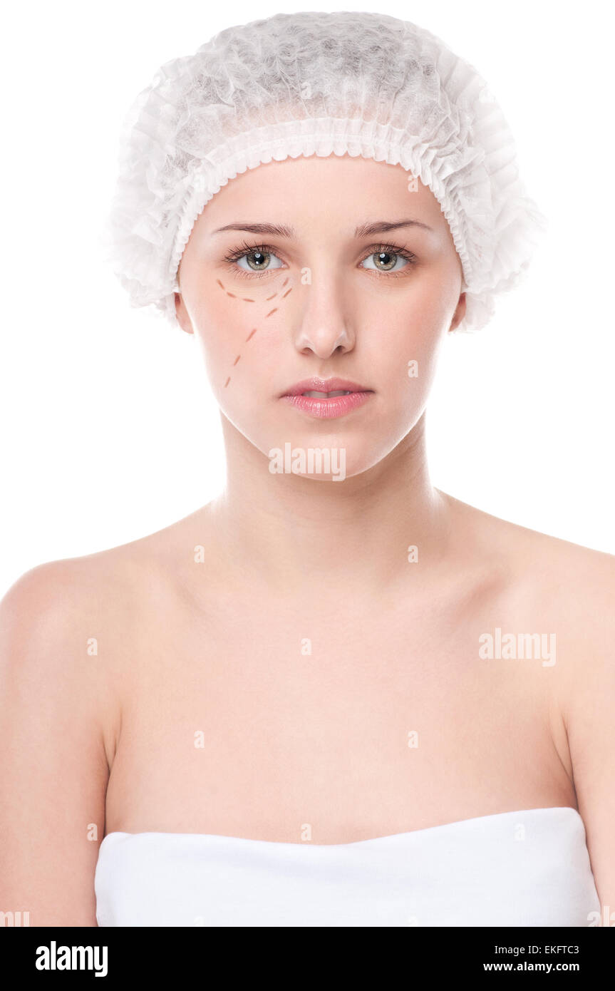 Beautician draw correction lines on woman face Stock Photo - Alamy