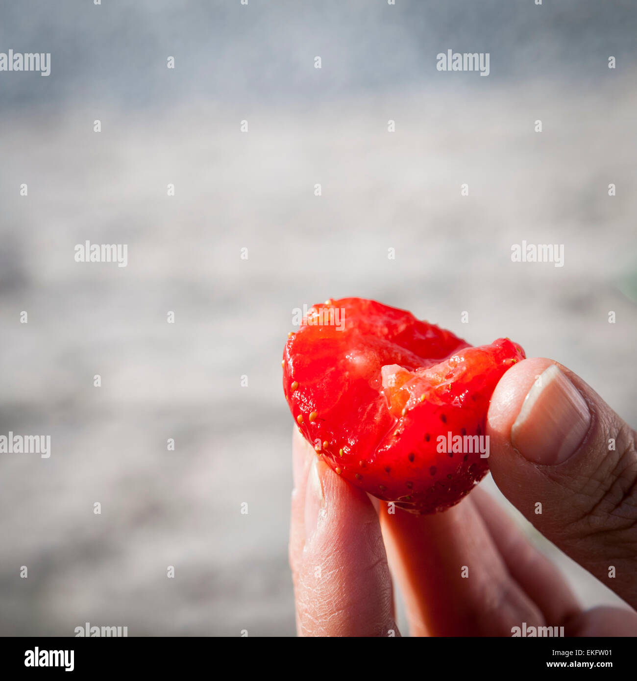 Hand fingers holding strawberry hi-res stock photography and images - Alamy