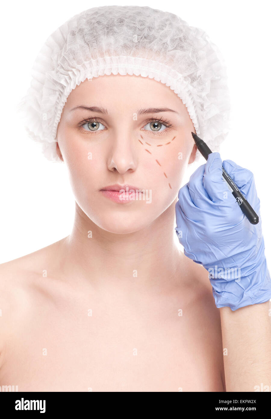 Beautician draw correction lines on woman face Stock Photo - Alamy
