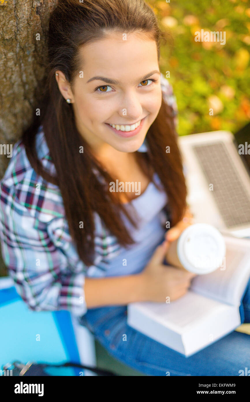 Teenager reading book outdoors hi-res stock photography and images - Alamy