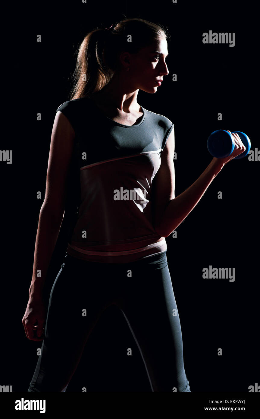 Beautiful sport woman doing power fitness exercise Stock Photo - Alamy