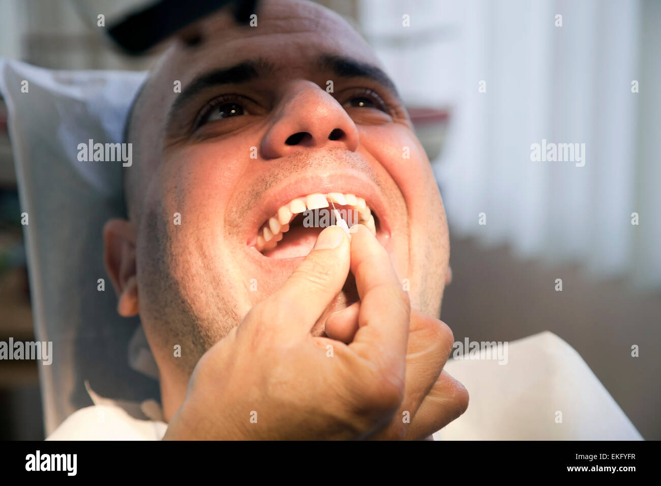 Professional dentist treating teeth hi-res stock photography and images ...