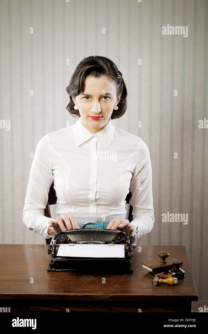 Woman typing in her office Stock Photo - Alamy