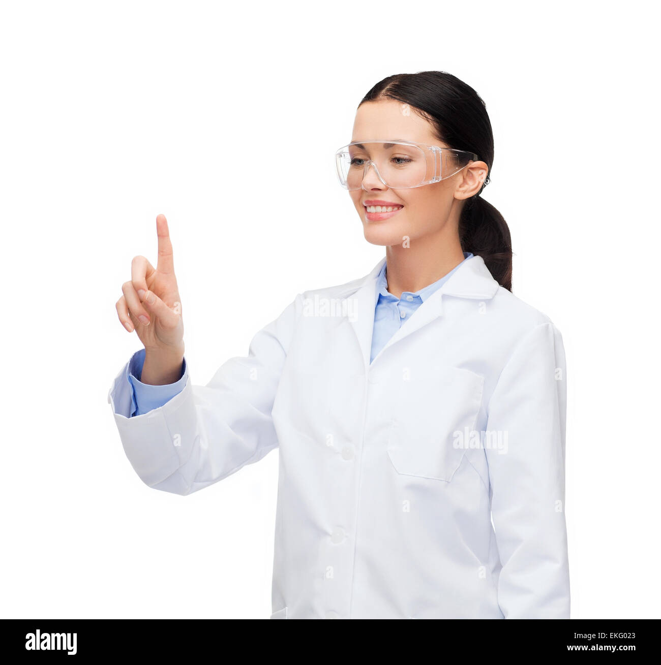 smiling female doctor pointing to something Stock Photo - Alamy