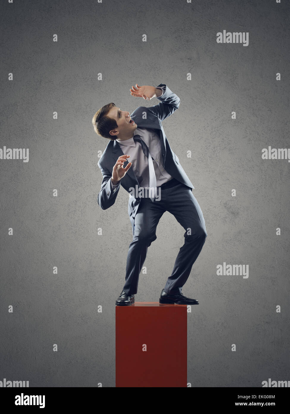 Young businessman scared Stock Photo - Alamy