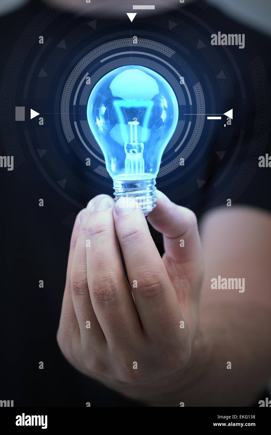 Man holding energy saving lamp hi-res stock photography and images - Alamy