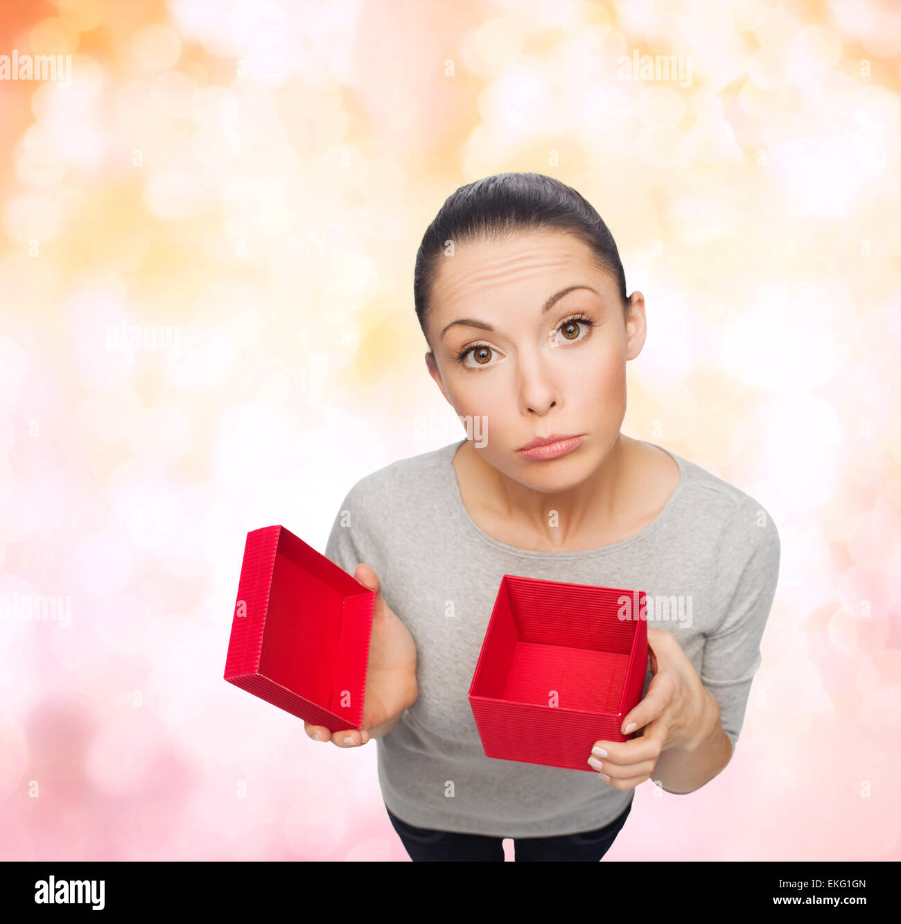 disappointed asian woman with empty red gift box Stock Photo - Alamy
