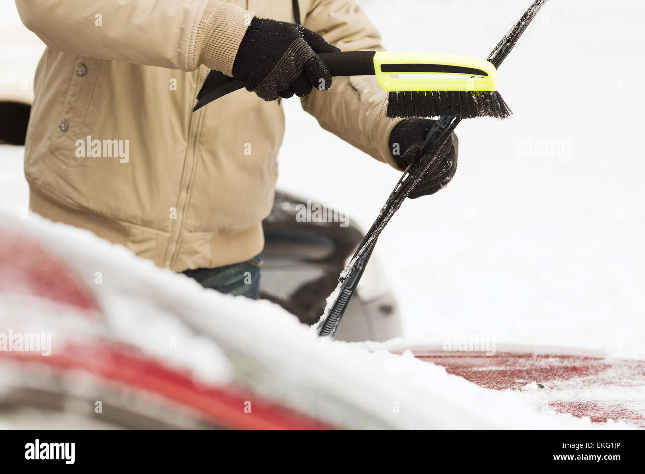 closeup of man cleaning snow from car Stock Photo - Alamy