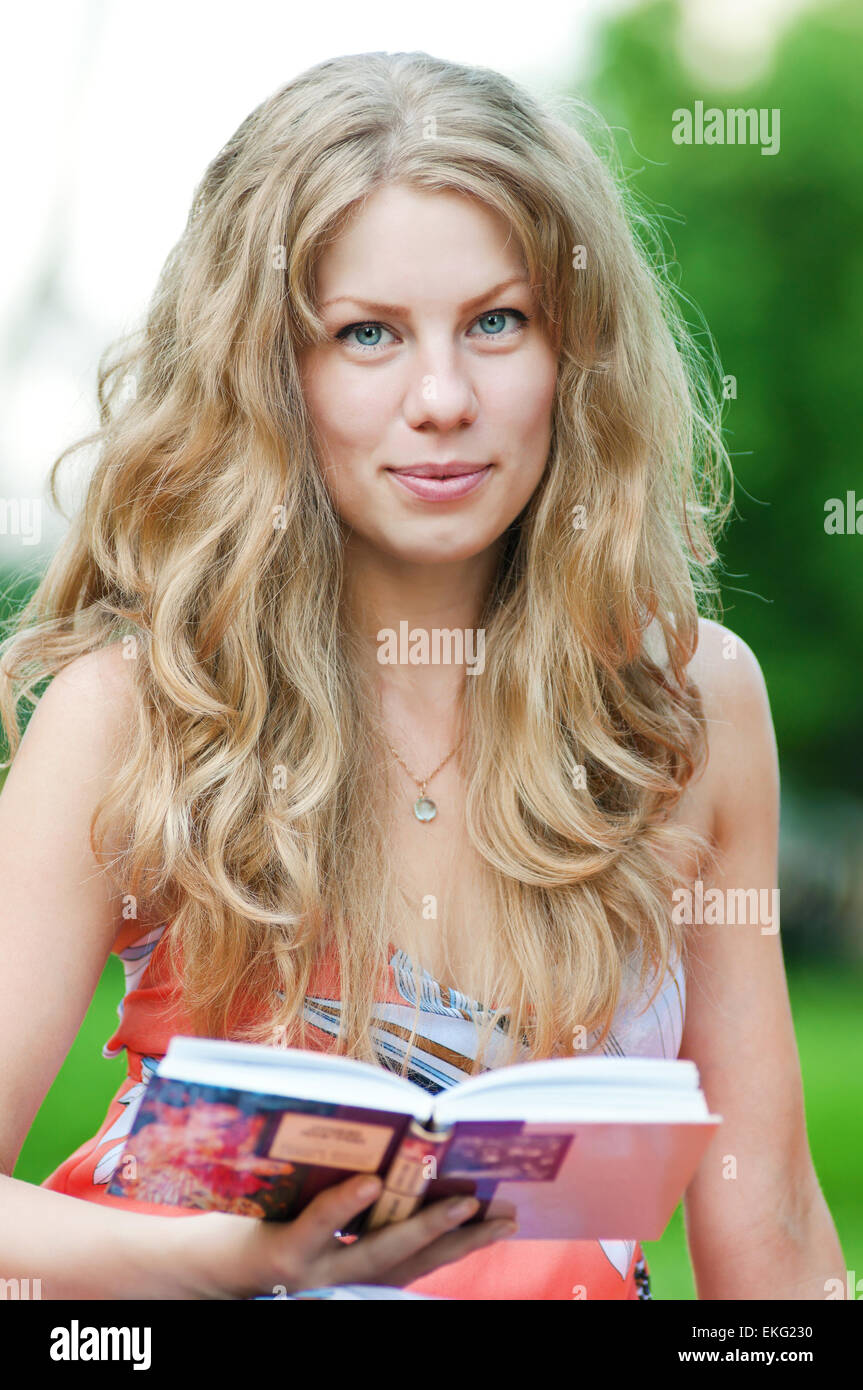 Beautiful young woman read book Stock Photo - Alamy