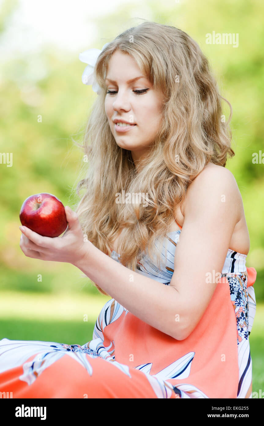 Beautiful woman with red apple Stock Photo - Alamy