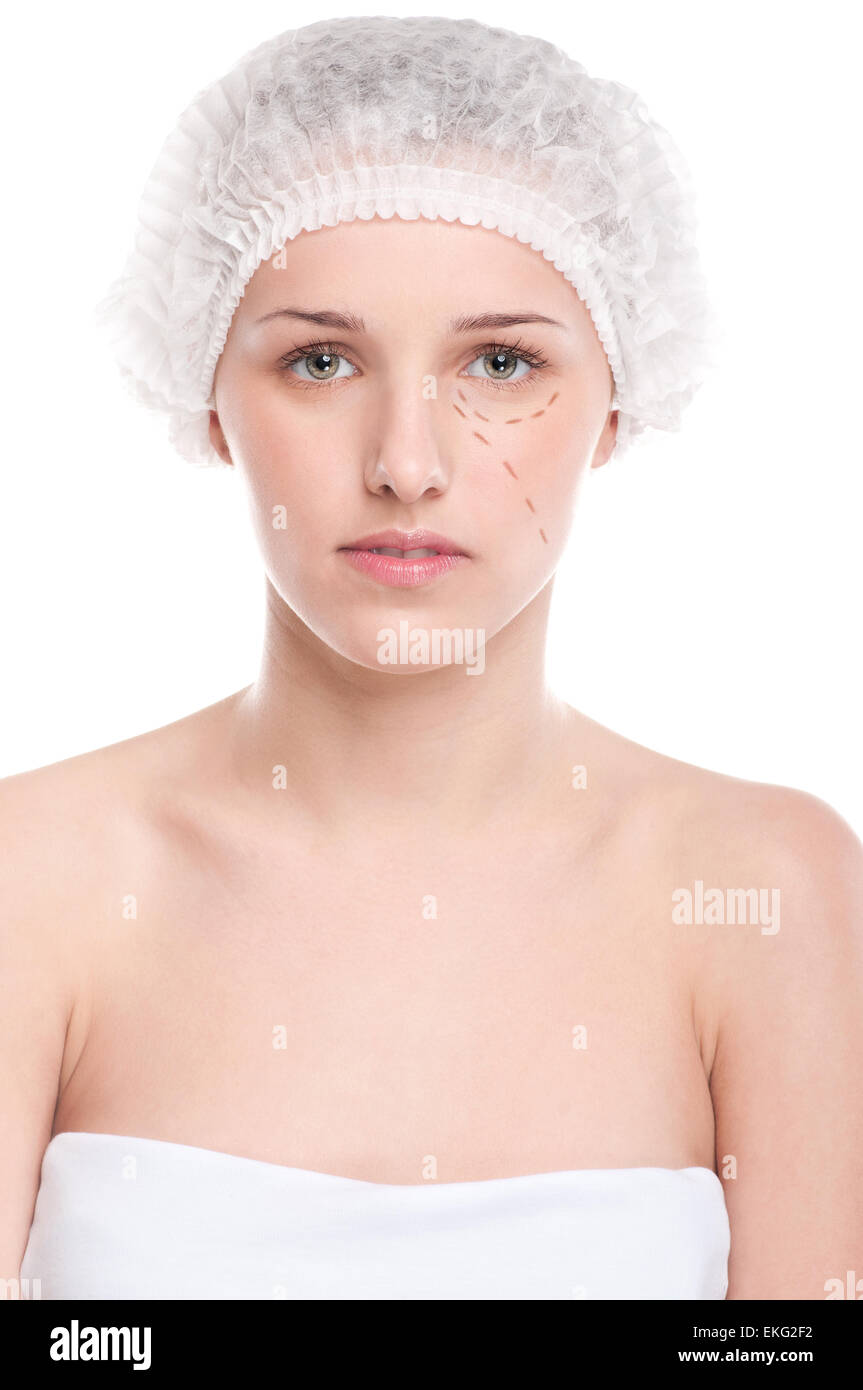 Beautician draw correction lines on woman face Stock Photo - Alamy