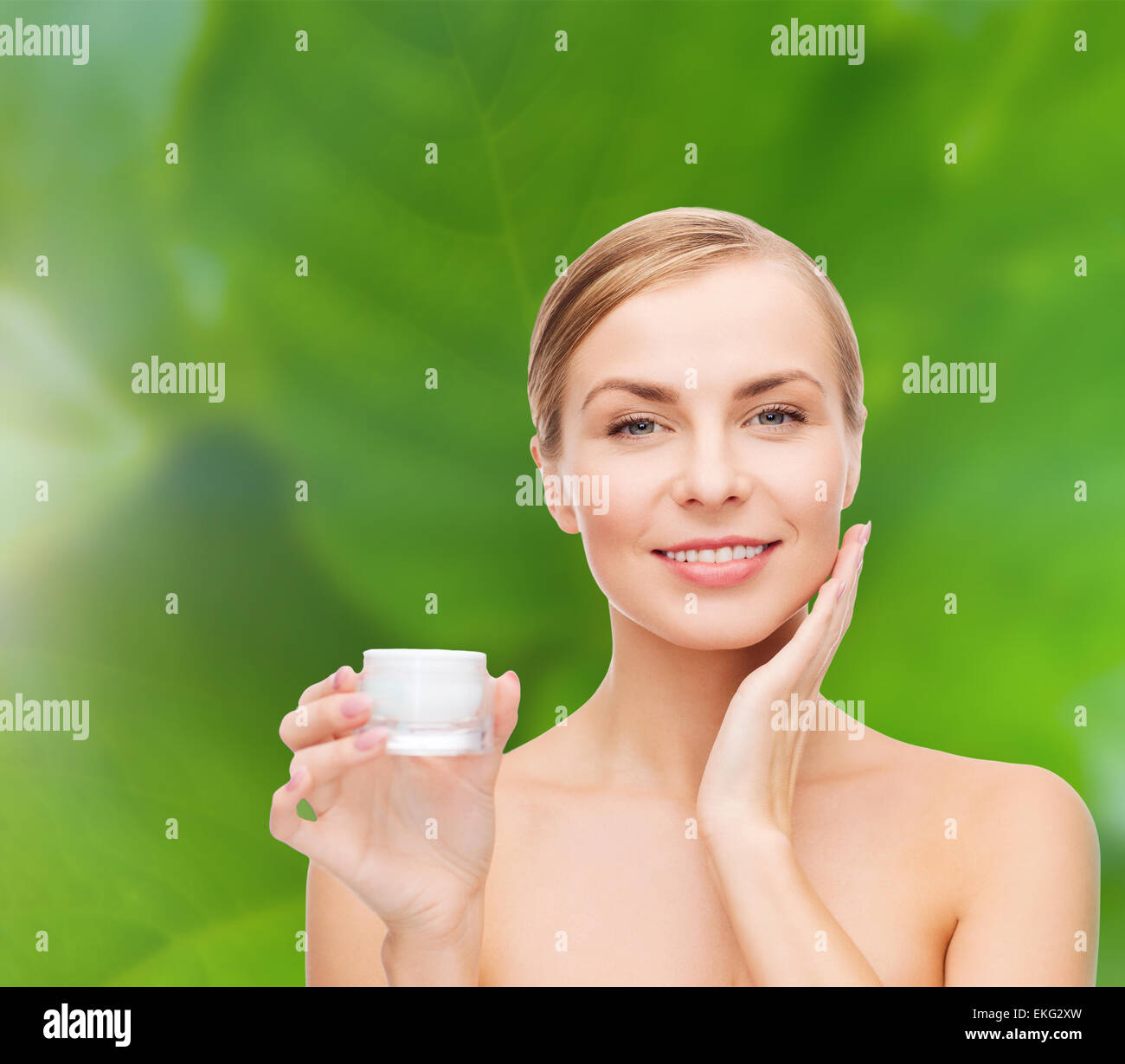 woman applying cream on her skin Stock Photo - Alamy