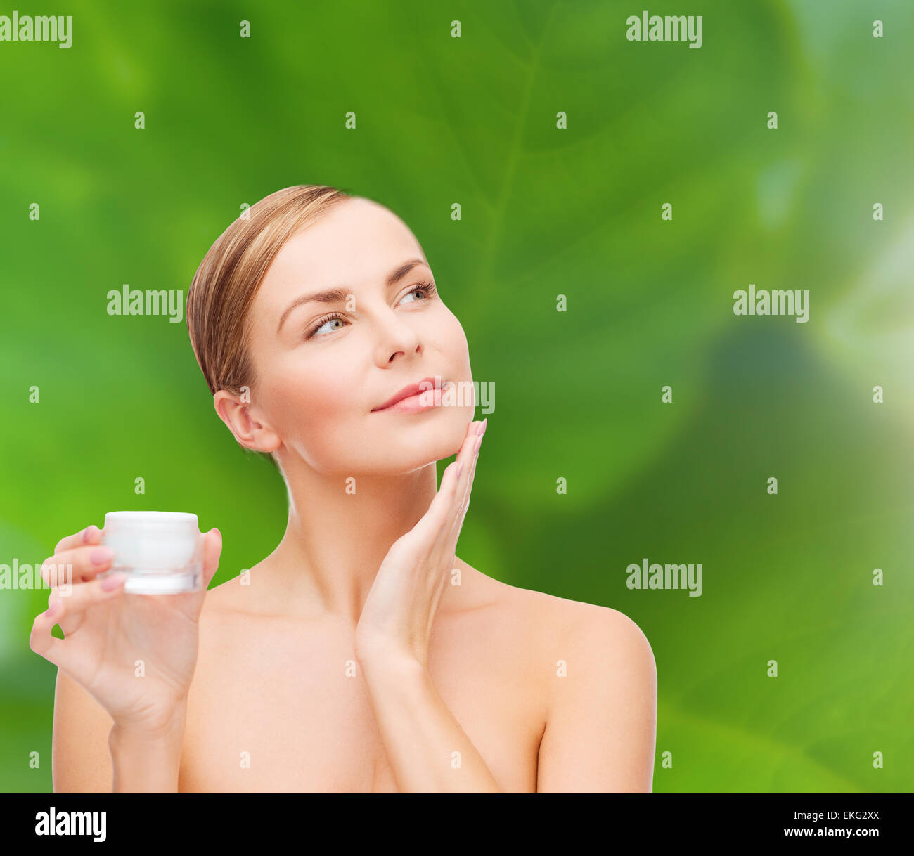 woman applying cream on her skin Stock Photo - Alamy