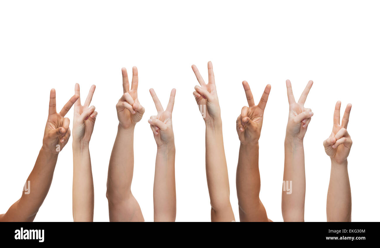 human hands showing v-sign Stock Photo - Alamy