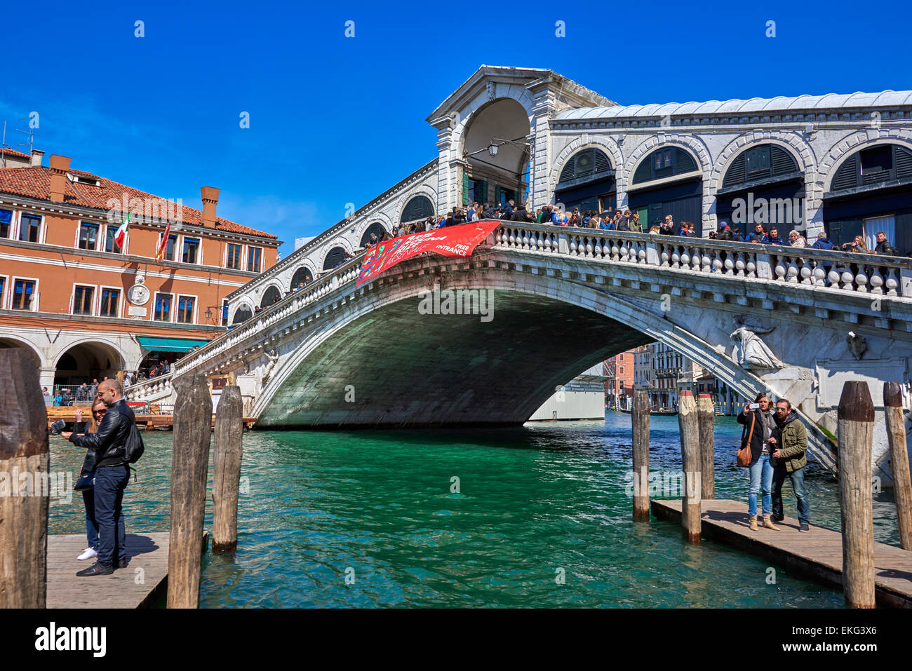 The Rialto Bridge is one of the four bridges spanning the Grand Canal ...