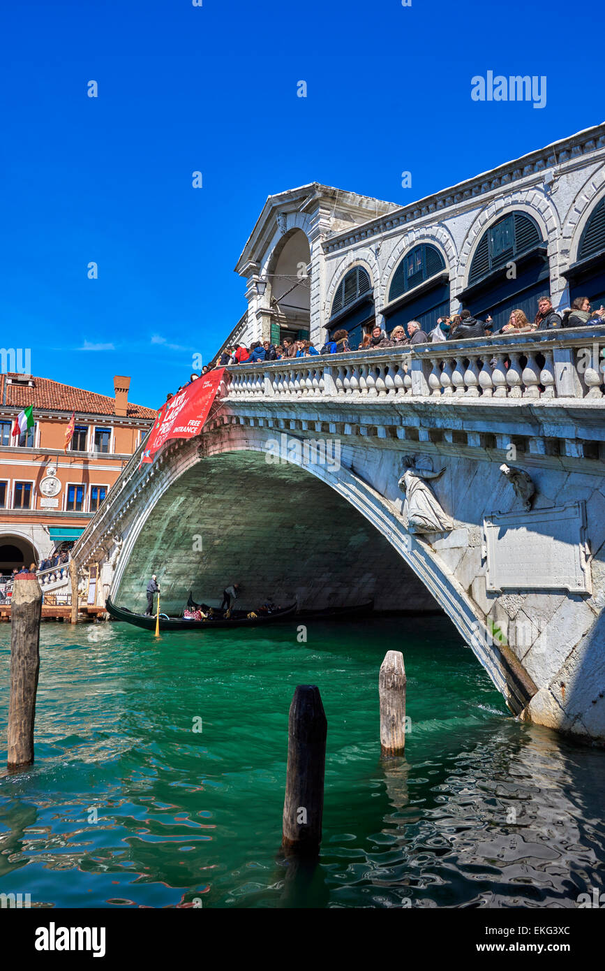 The Rialto Bridge is one of the four bridges spanning the Grand Canal ...